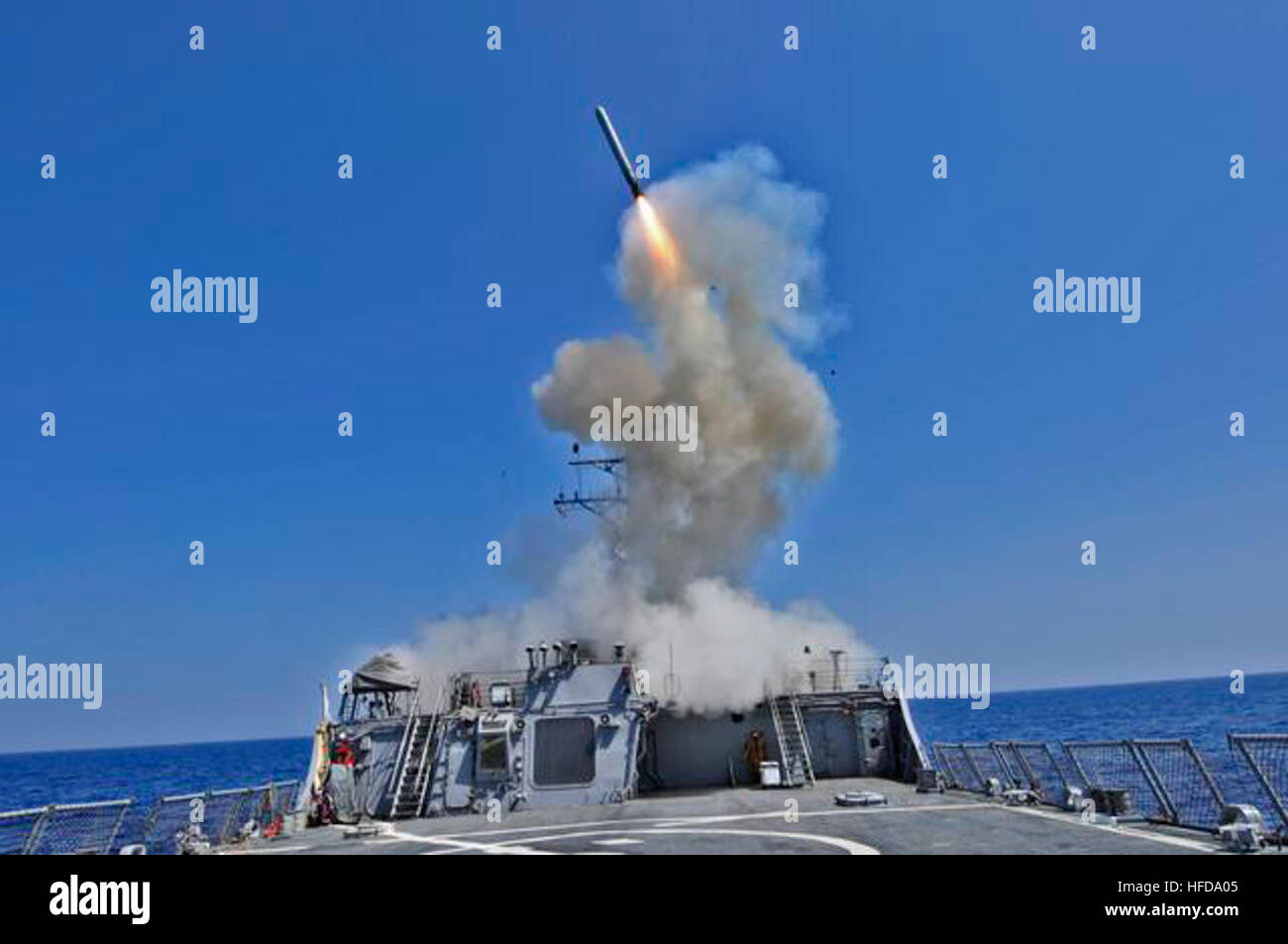 The guided missile destroyer USS Barry (DDG 52) launches a Tomahawk ...