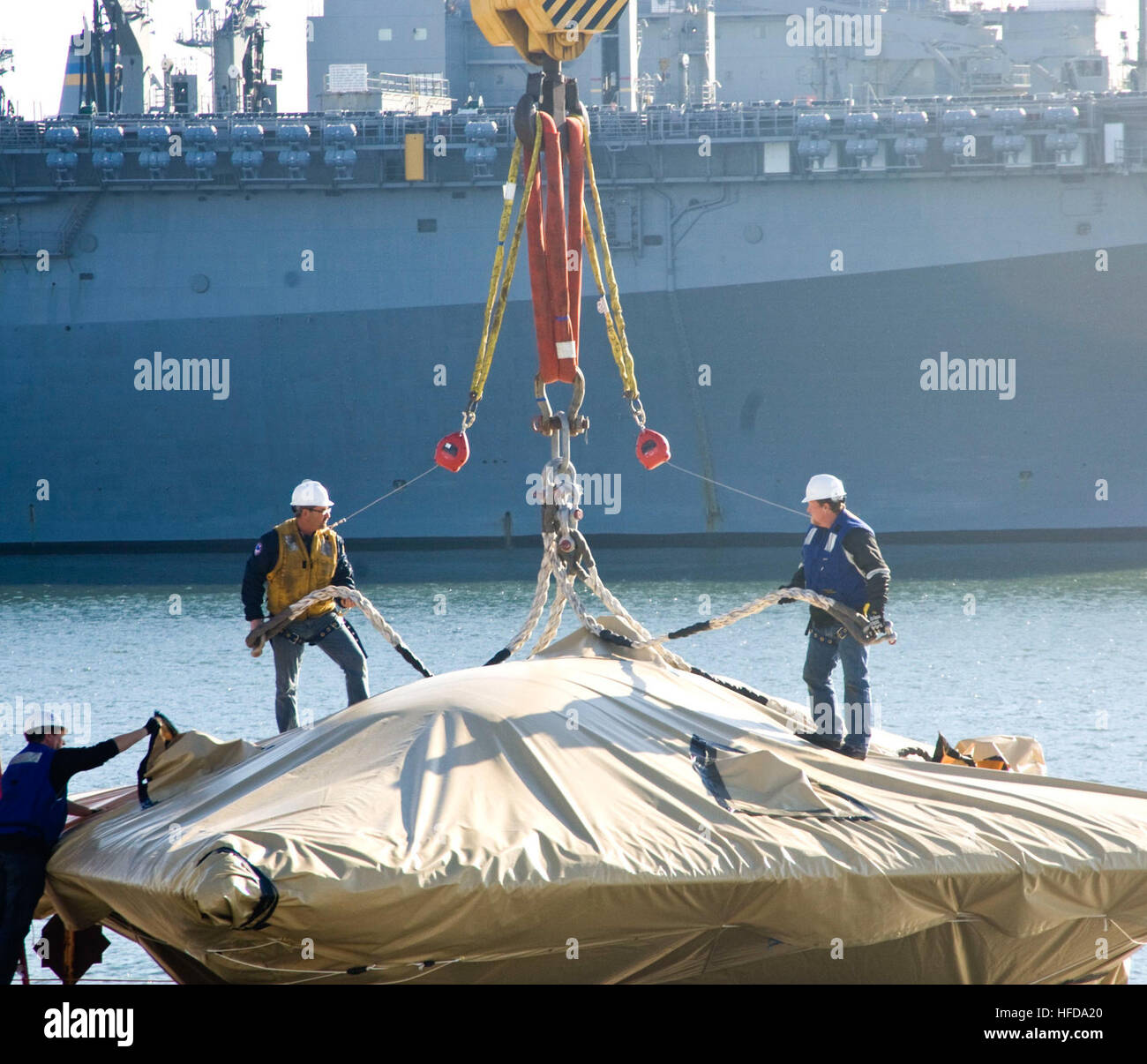 NORFOLK (Nov. 26, 2012) Contractors hoist the X-47B Unmanned Combat Air ...