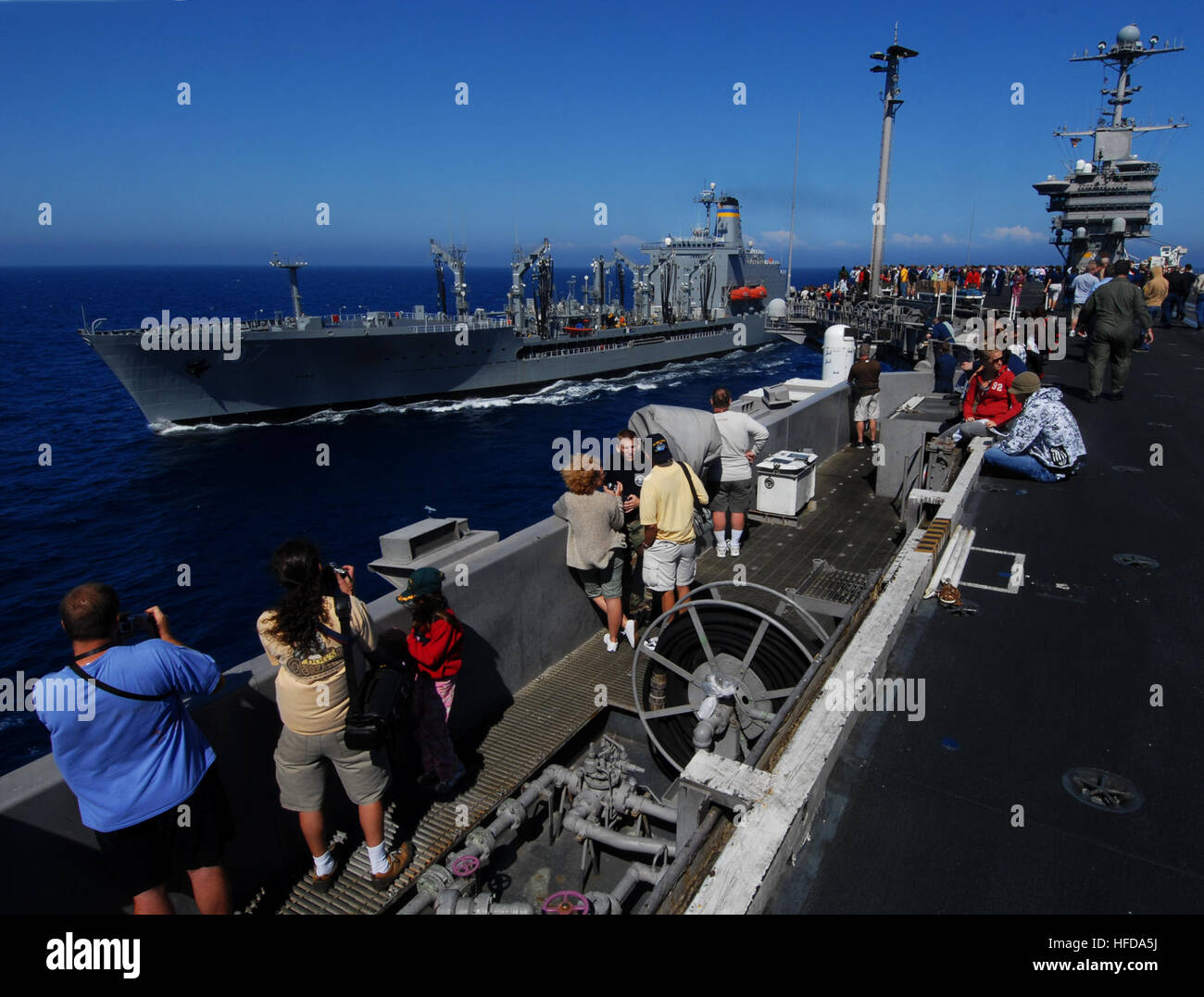 Sailors and families observe USNS Henry J. Kaiser conduct a ...