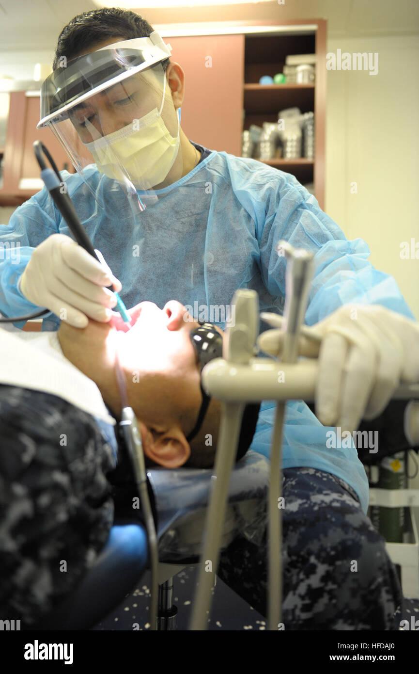 Hospital Corpsman 2nd Class performed dental cleaning on an Aviation ...