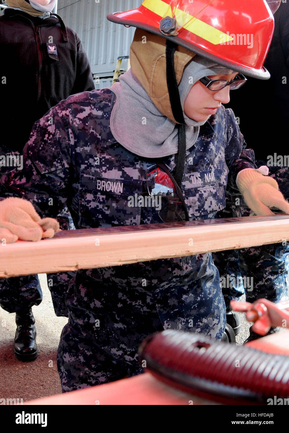 Aviation Boatswain's Mate (Handling) Airman Lindsey Brown measures wood ...