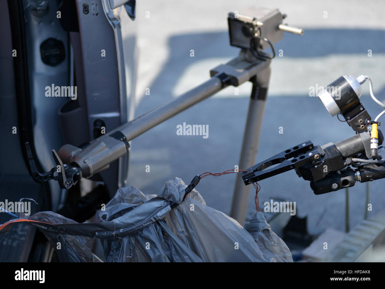 Robots controlled by U.S. Navy explosive ordnance disposal technicians ...