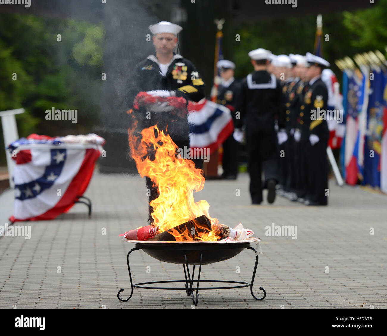 At Naval Base Kitsap - Bangor, a flag retirement ceremony is conducted ...