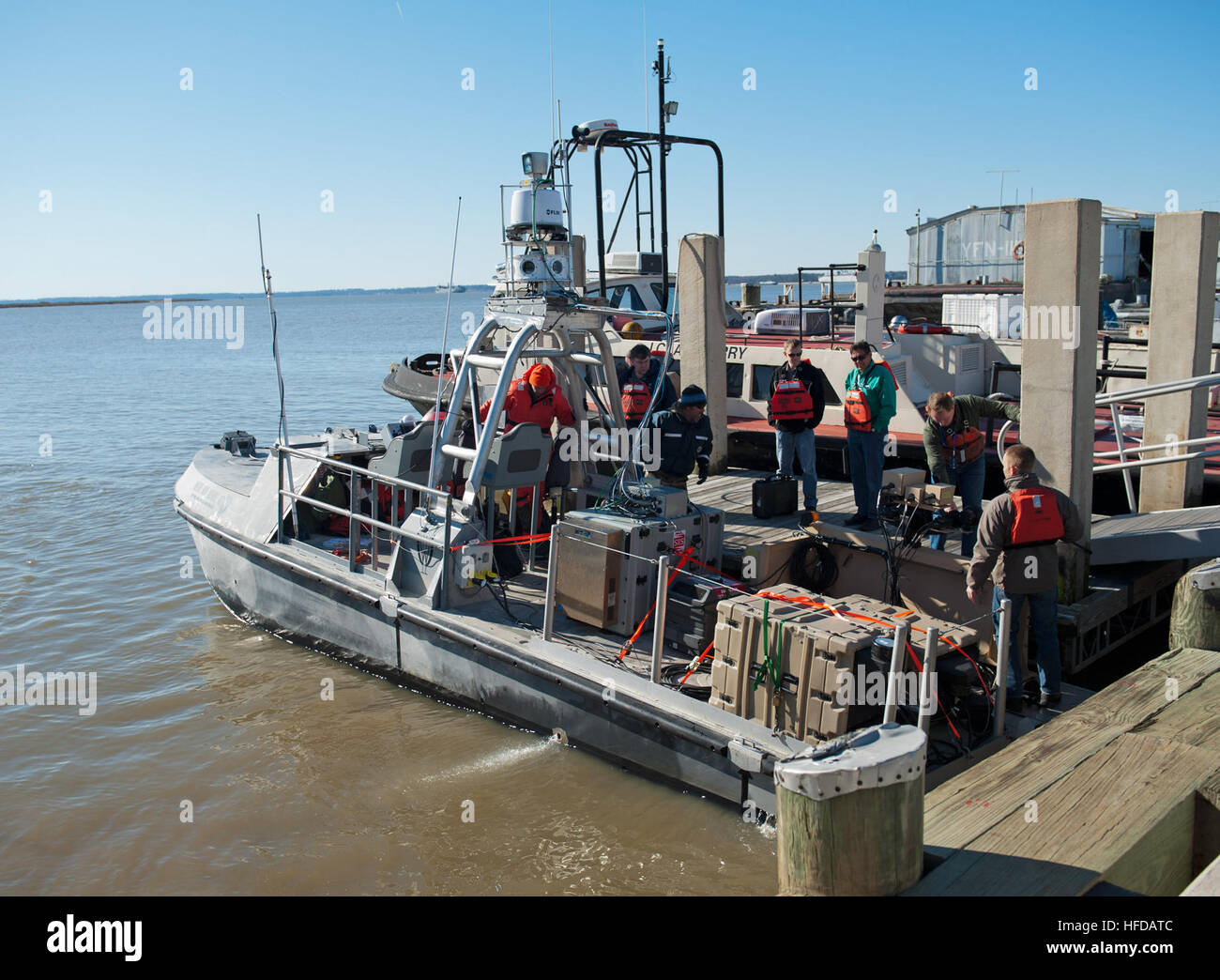 U.S. Sailors, along with engineers, technicians and support personnel ...