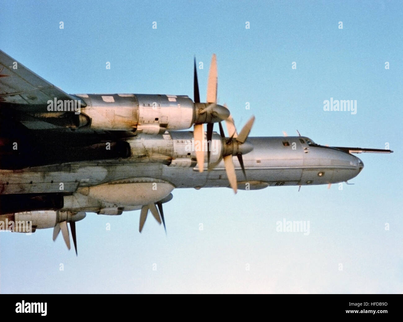 An air to air left side view of the front section of a Soviet Tu-142 ...