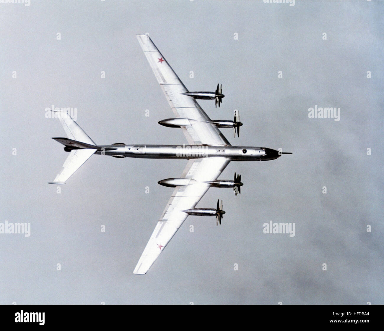 A Soviet Tu-95 Bear strategic bomber is captured in an air-to-air ...