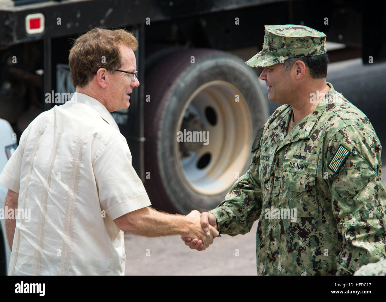 U.S. Ambassador to Honduras James D. Nealon, left, exchanges greetings ...