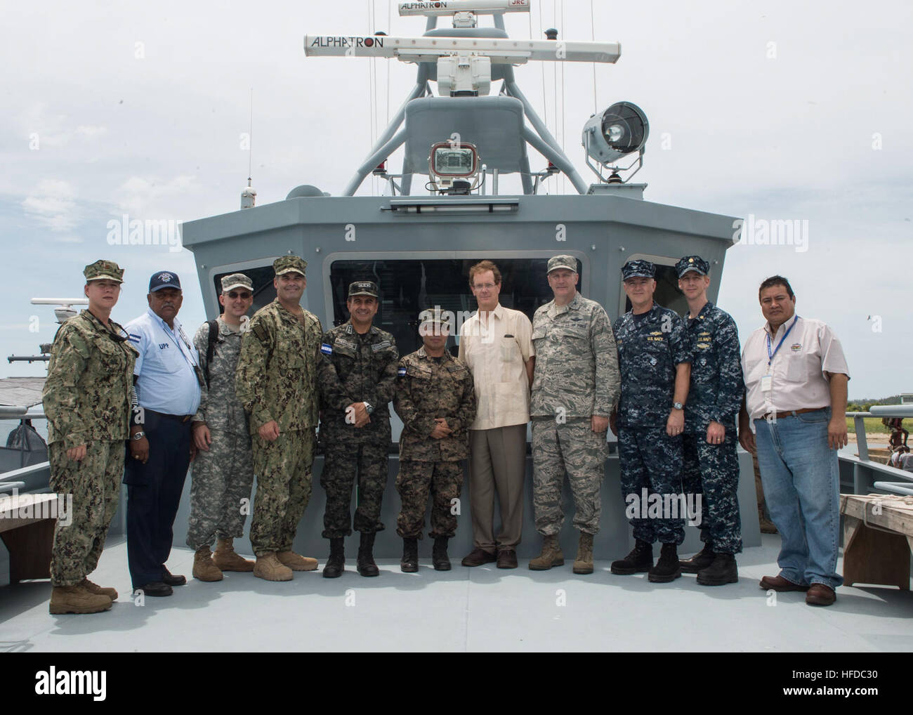 U.S. and Honduran military and government officials stand for a photo ...