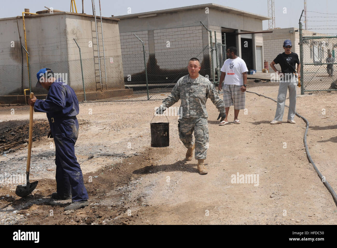 U.S. Army Spc. Ryan Soon, center left, helps residents of Warba Island ...