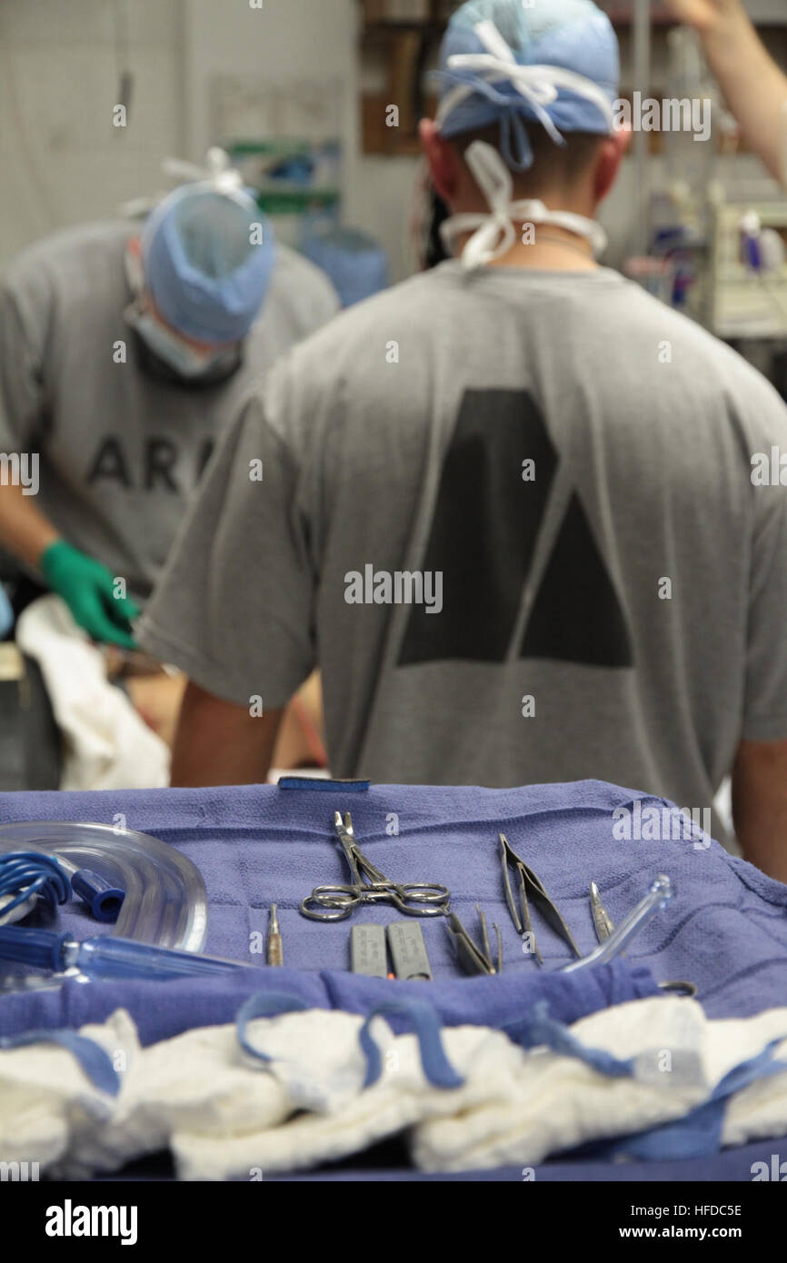 U.S. Army Maj. Jason Hawksworth, left, a general surgeon assigned to ...