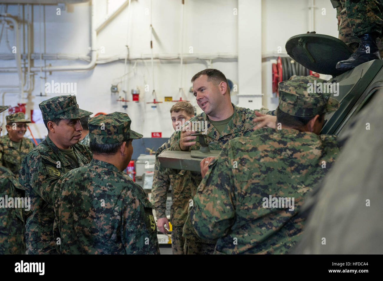 U.S. Marine Corps Staff Sgt. Christopher Chambers, second from right ...