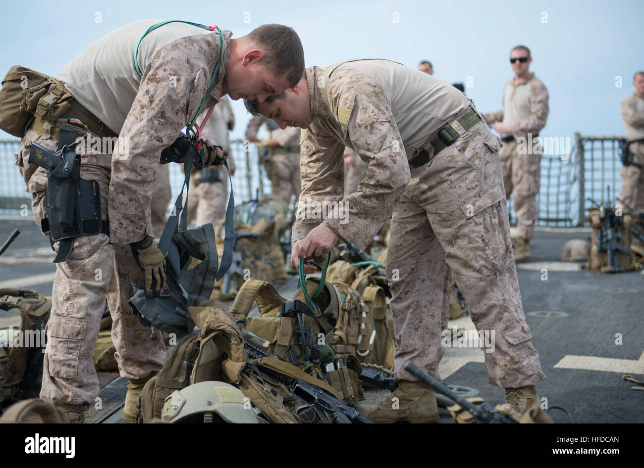 Marines aboard USS Boxer (LHD 4) conduct a gear check on USS Mason (DDG ...