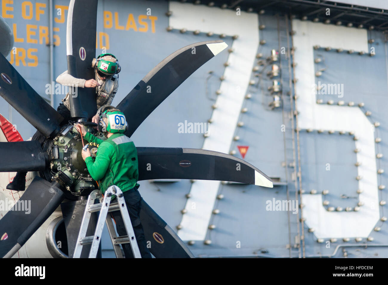 U.S. Navy Aviation Machinist's Mate 3rd Class Clinton Walker, top, and ...