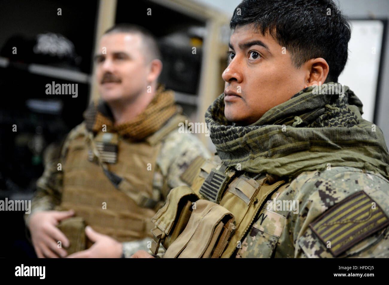U.S. Navy Boatswain's Mate 1st Class Eddie Montalvo, right, and ...