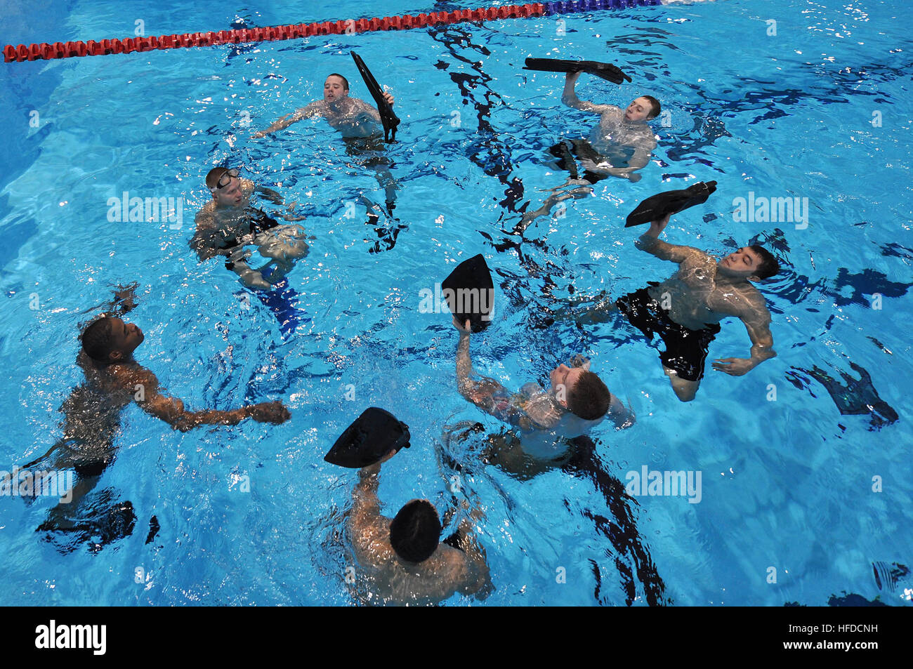 Candidates for special programs perform water competency training under ...