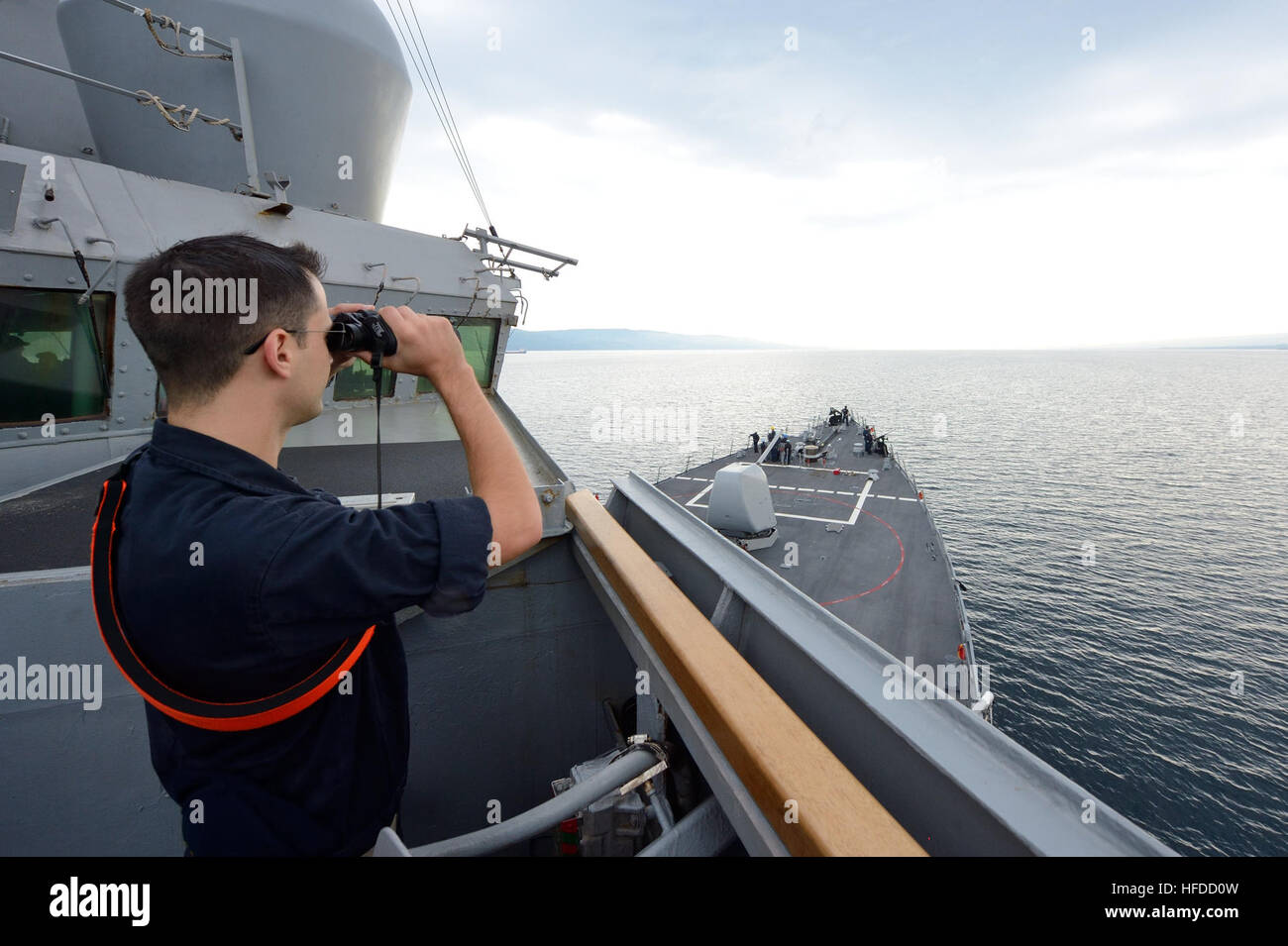 U.S. Navy Ensign Shea Miller watches for outbound civilian merchant ...