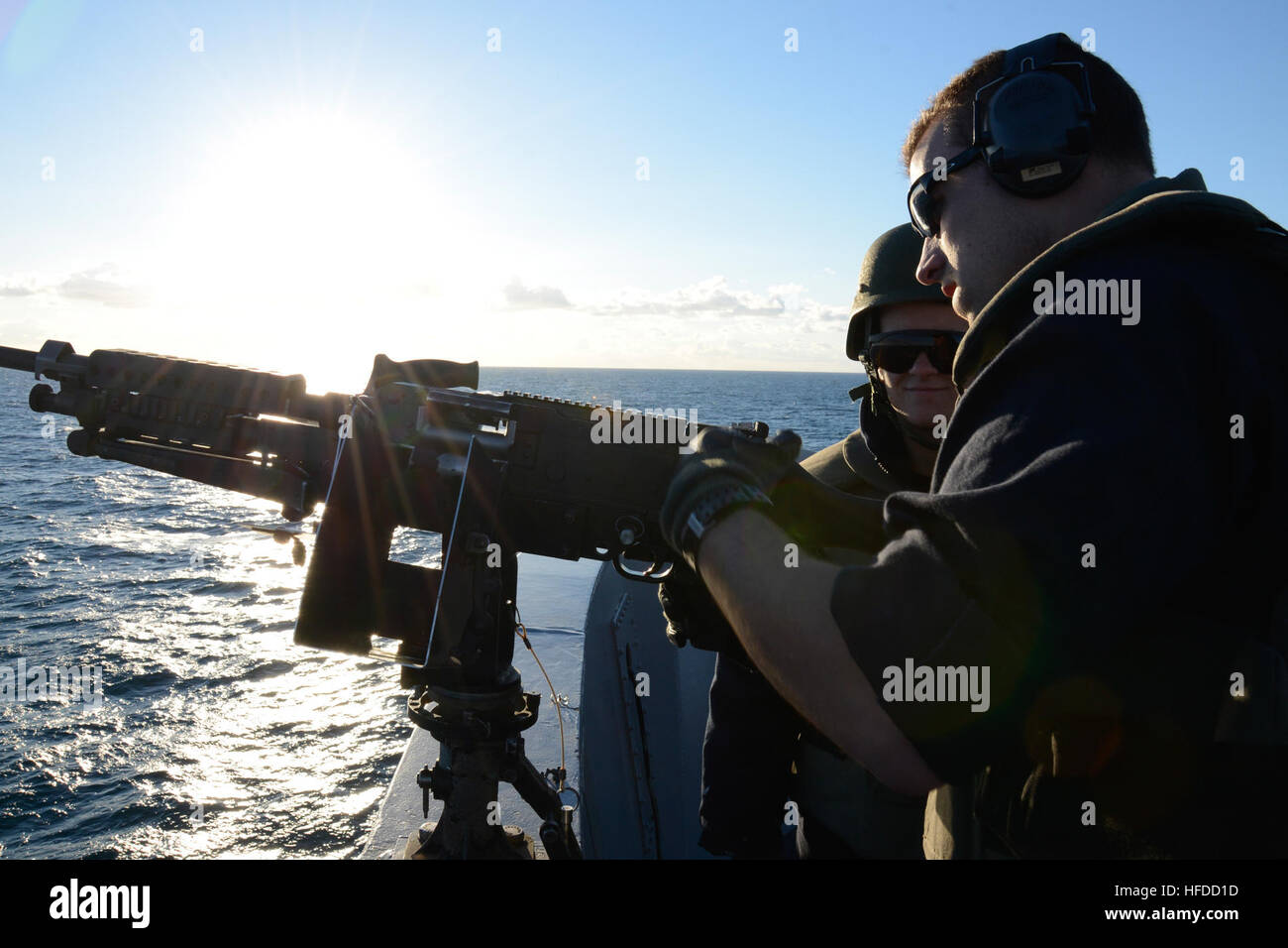 U.S. Navy Gunner's Mate Seaman Chancellor Philips, foreground ...