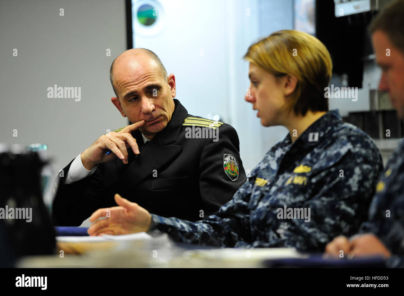 U.S. Navy Lt. Catherine Reppert, center, the operations officer of the ...