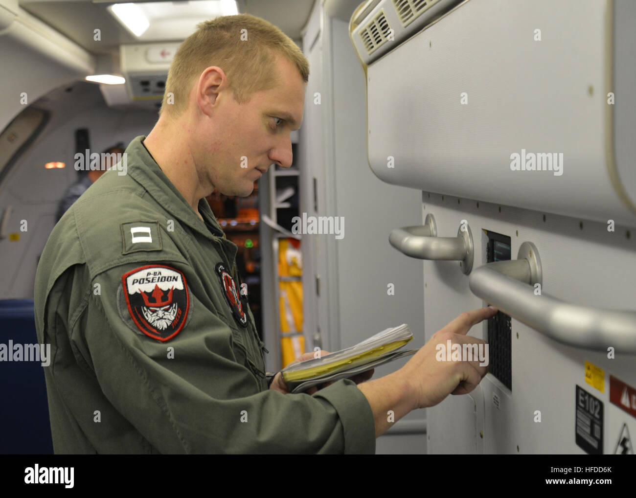 U.S. Navy Lt. Joshua Mize, a tactical coordinator assigned to Patrol ...
