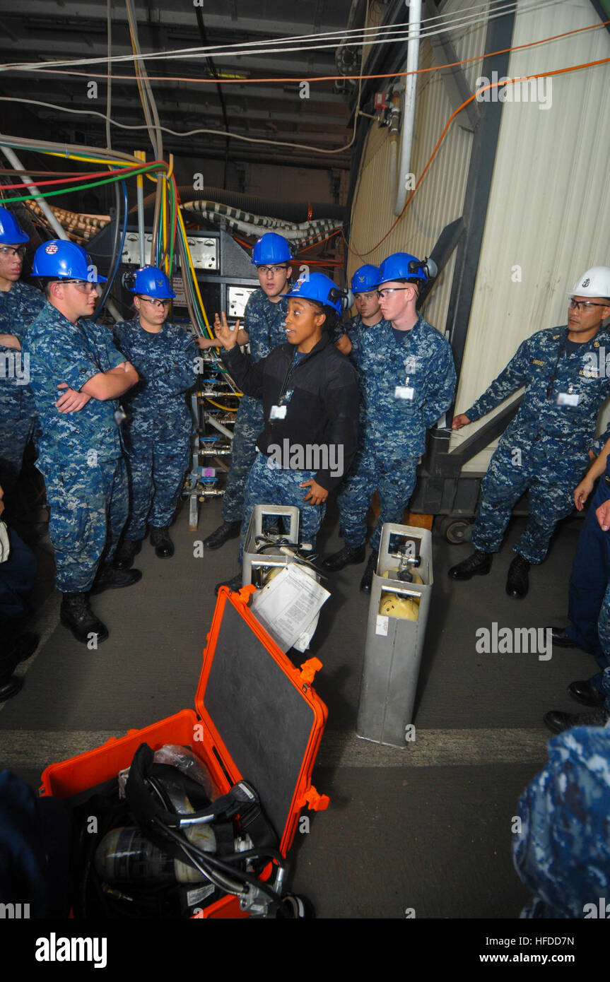 U.S. Navy Machinery Repairman 2nd Class Madison Robinson, center, an in ...