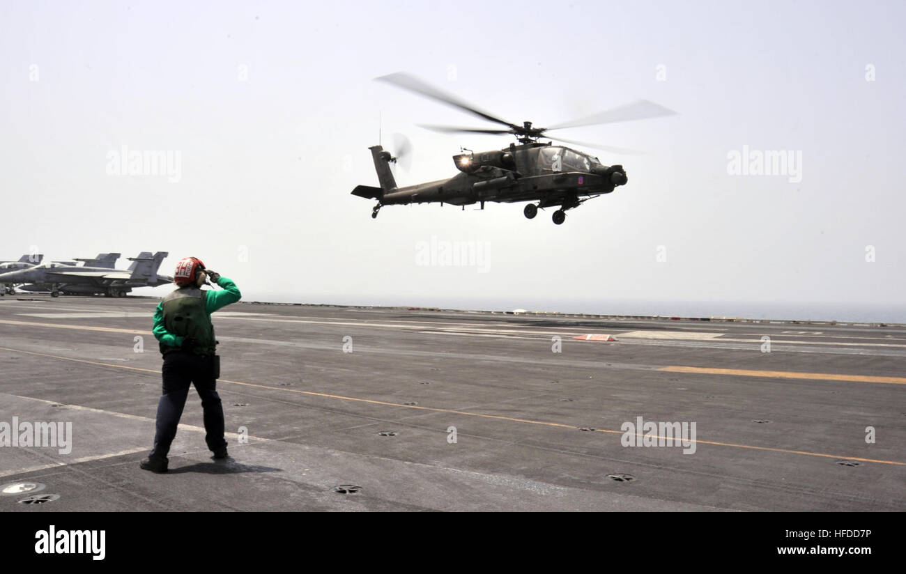 An AH-64 Apache helicopter assigned to Helicopter Sea Combat Squadron 9 ...