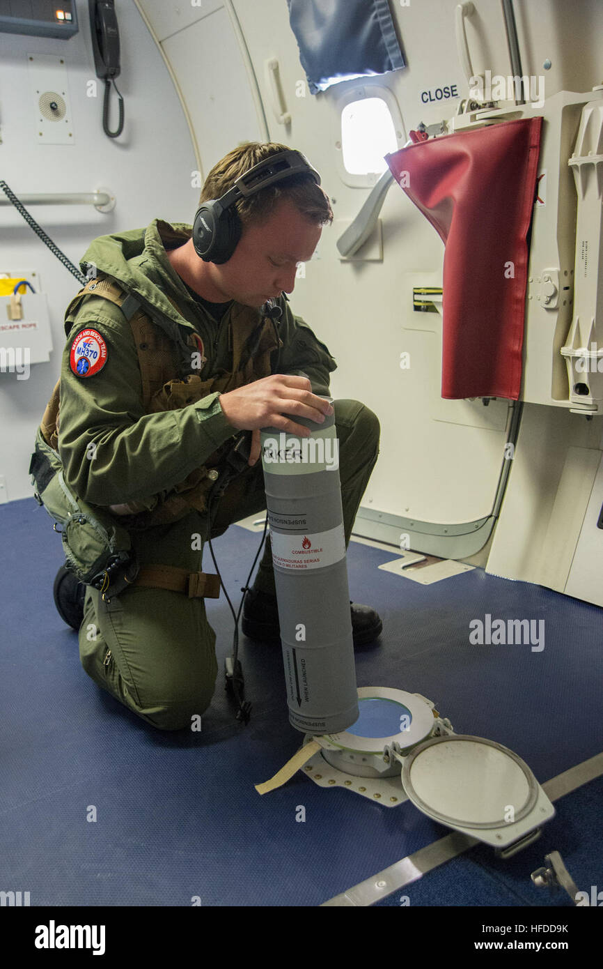 A U.S. Navy Naval Aircrewman prepares to deploy a Mark 58 marine ...
