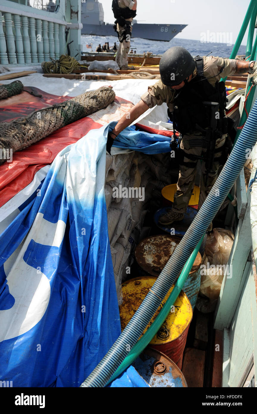 U.S. Navy visit, board, search and seizure team members check cargo ...