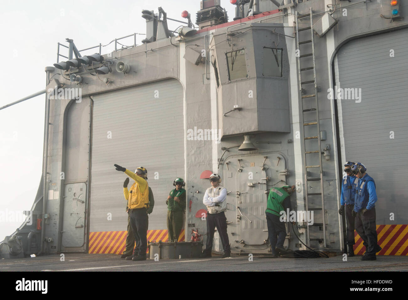 U.S. Sailors conduct flight operations on the flight deck of the guided ...