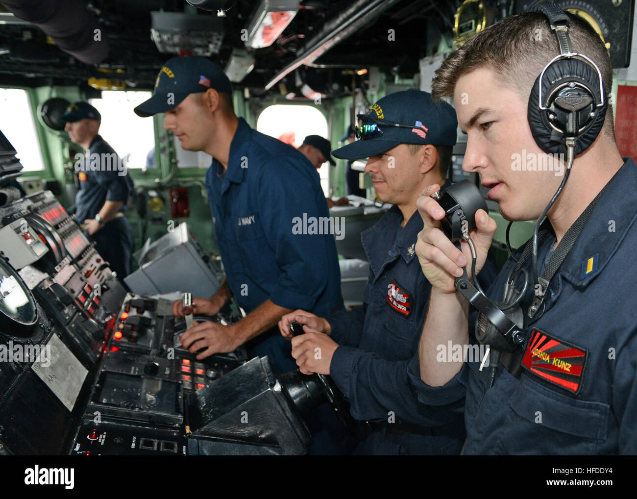 U.S. Sailors man the bridge aboard the mine countermeasures ship USS ...