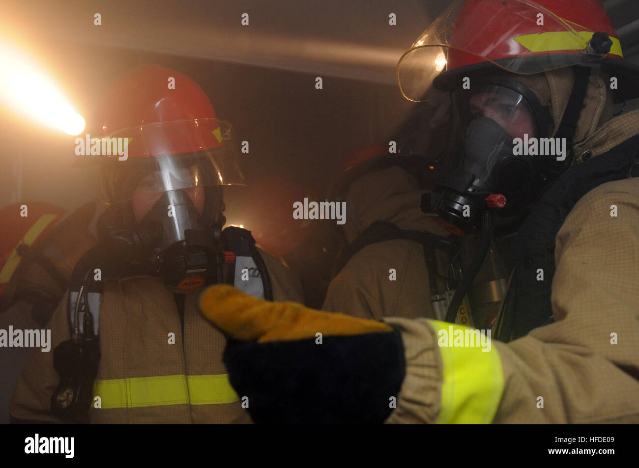 U.S. Sailors participate in a general quarters training exercise aboard ...