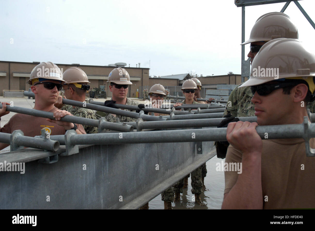 U.S. Sailors with Naval Mobile Construction Battalion (NMCB) 25 and ...