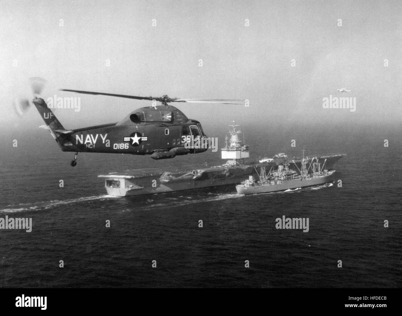 UH-2B over USS Enterprise (CVAN-65) and USS Virgo (AE-30) 1966 Stock ...