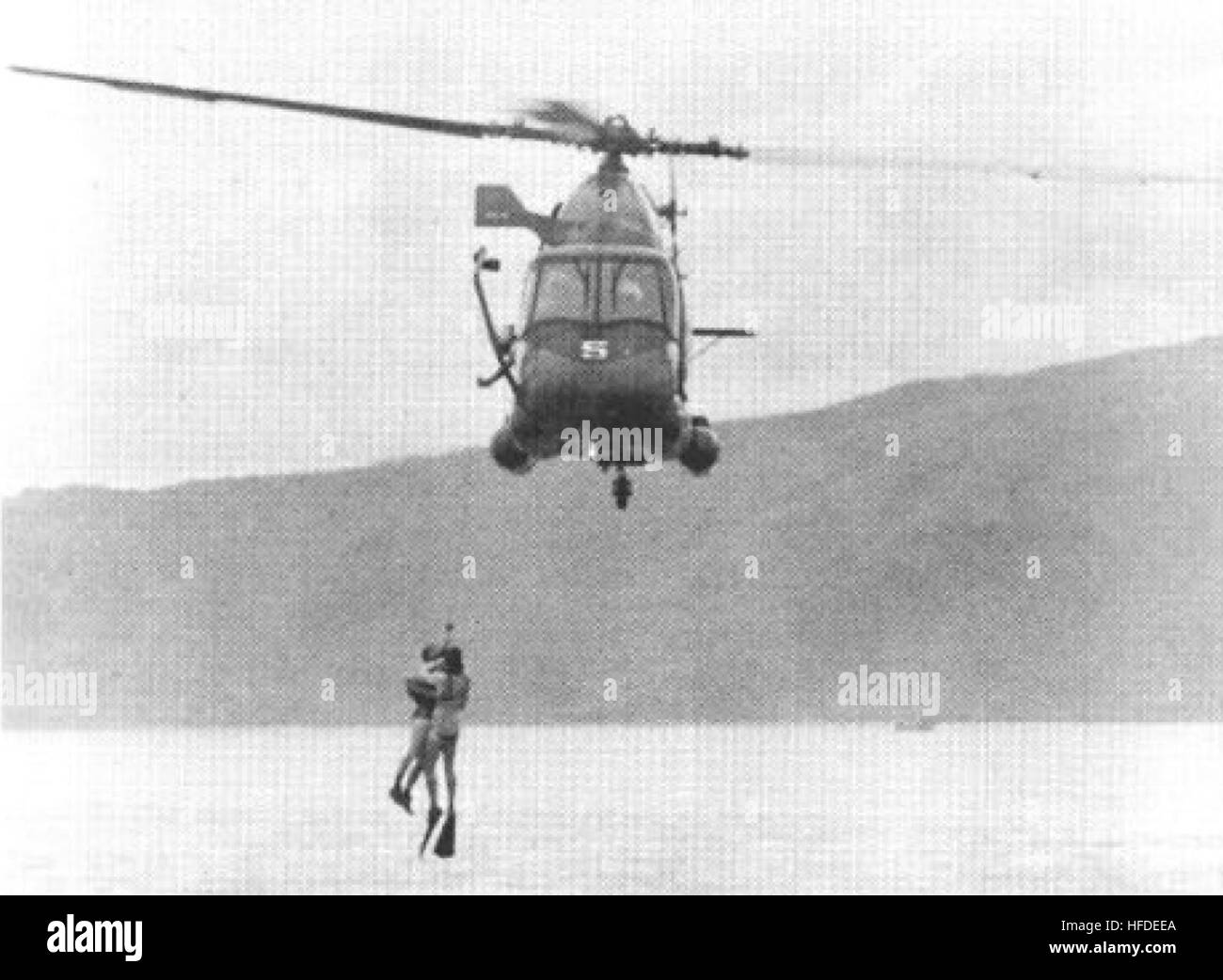 A UH-2 Seasprite helicopter conducts a pilot rescue operation during a ...