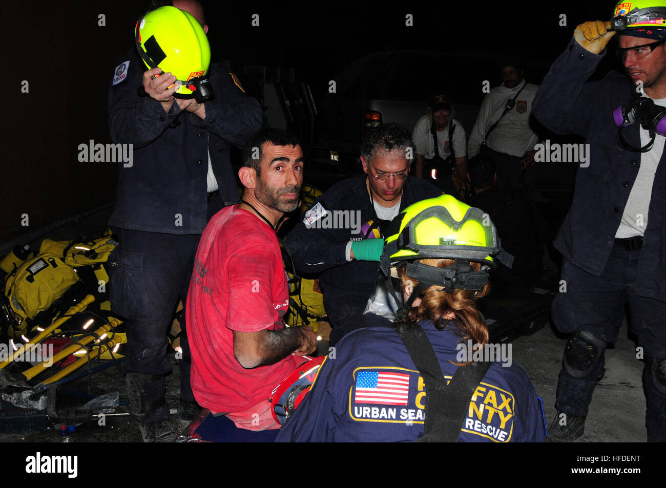 A member of the Turkish rescue squad Akut receives stitches on his ...