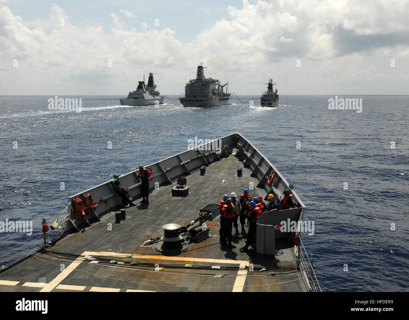 Sailors standby to handle lines on the foc'sle of the Oliver Hazard ...