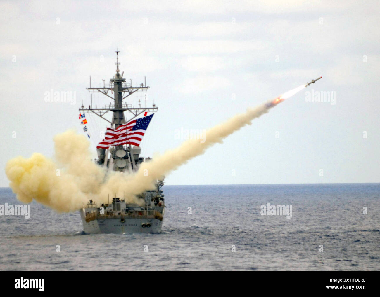 A Harpoon missile is launched from the guided-missile destroyer USS ...