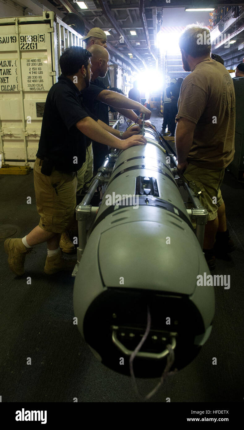 Personnel assigned to Commander, Task Group 52.3, prepare an unmanned ...