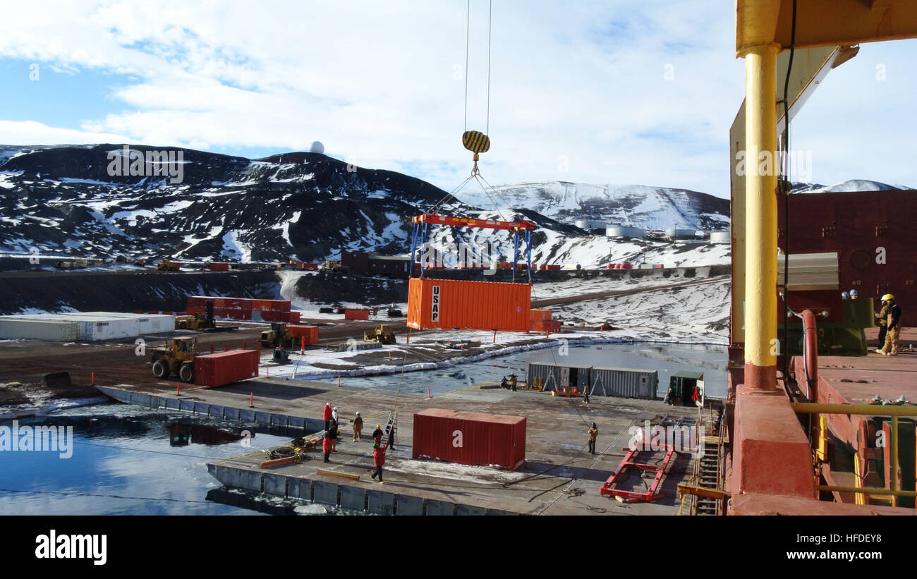 U.S. sailors move conex containers during cargo handling operations at ...