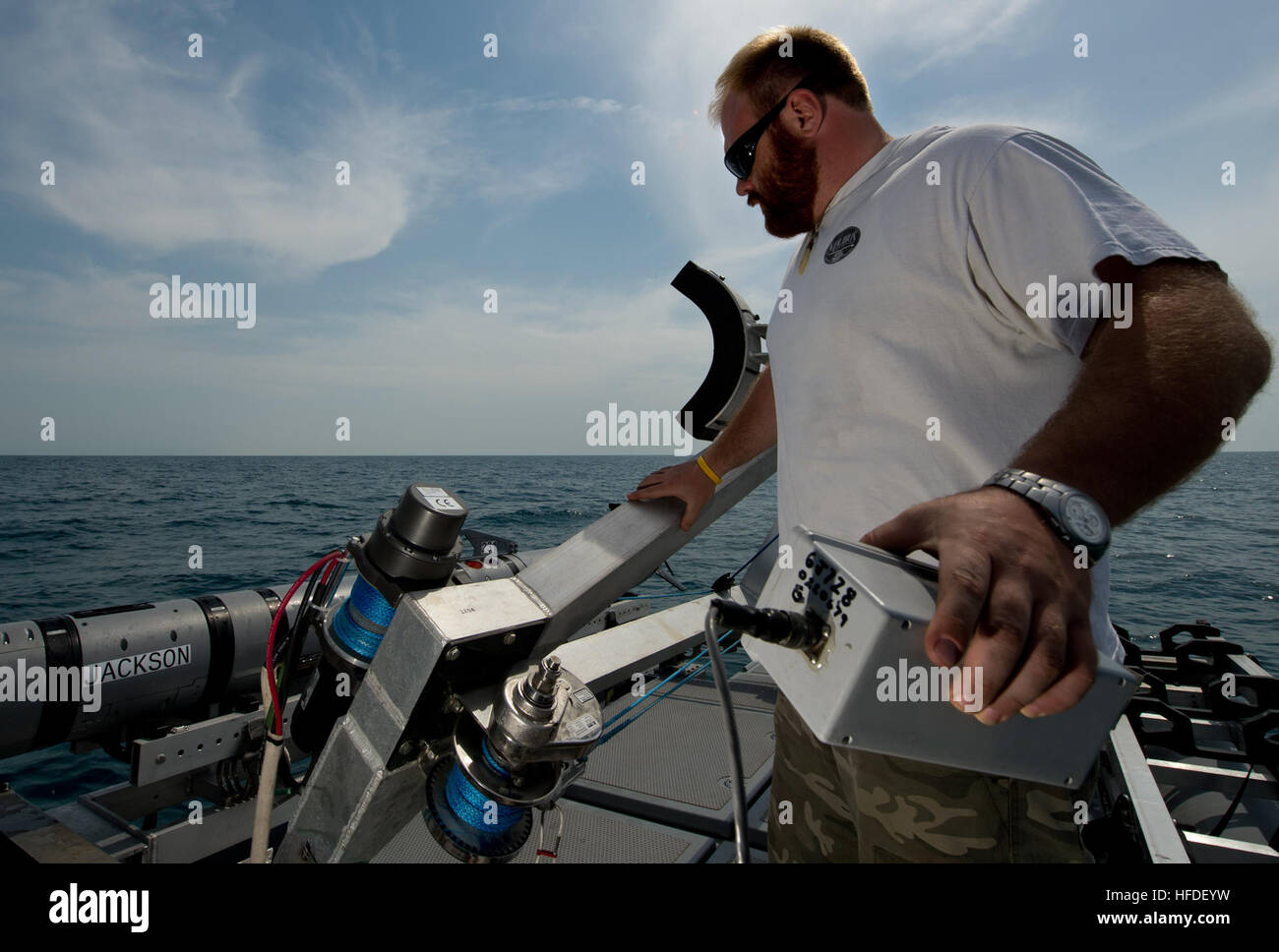 A U.S. Navy sailor secures an unmanned underwater vehicle to a rigid ...