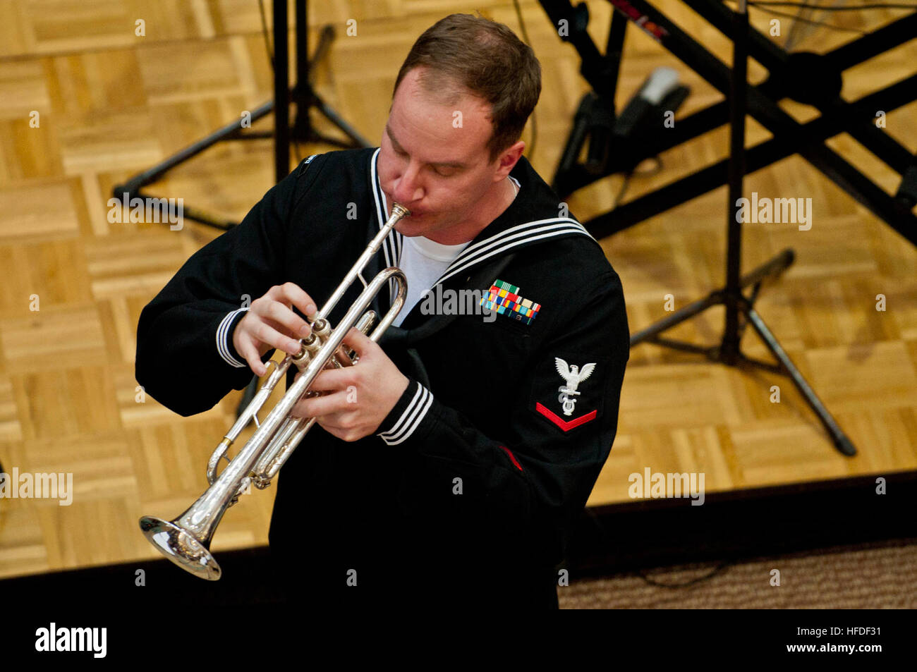 Musician 3rd Class Benjamin Foss of the U.S. 7th Fleet brass band plays ...