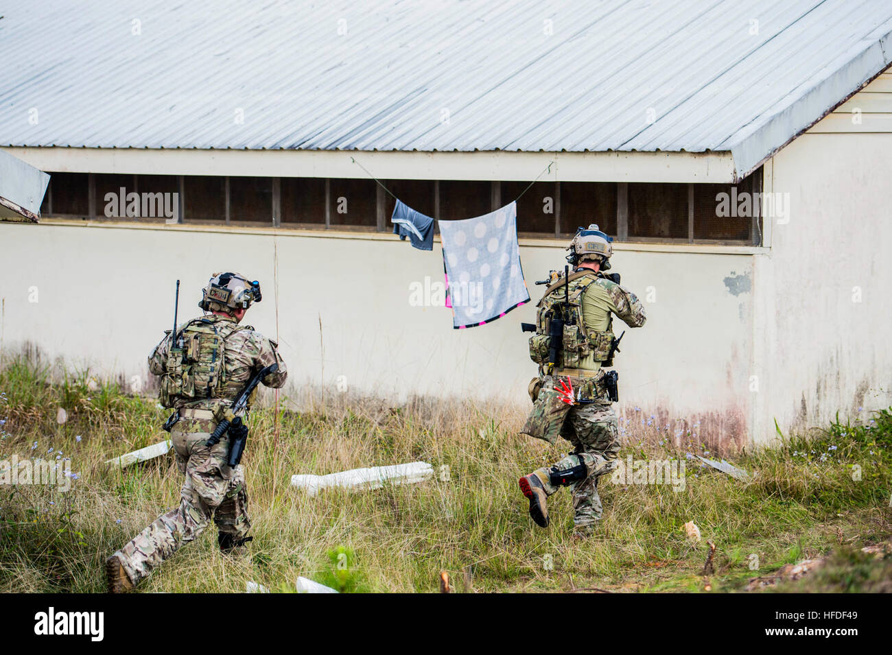 U.S. Special Forces soldiers search buildings in a compound while on a ...