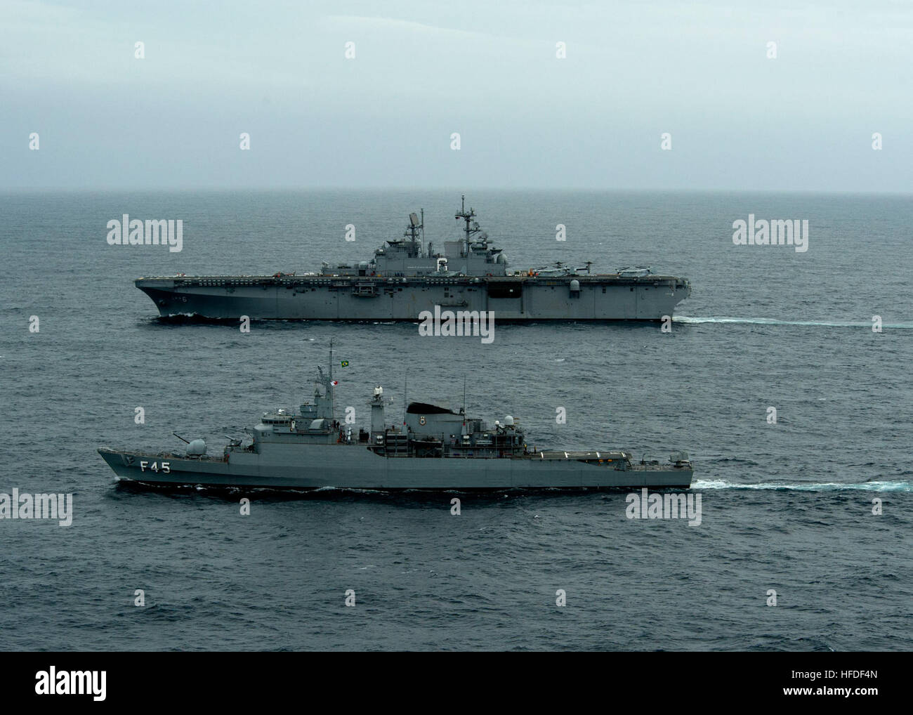 The future amphibious assault ship USS America (LHA 6) sails alongside ...