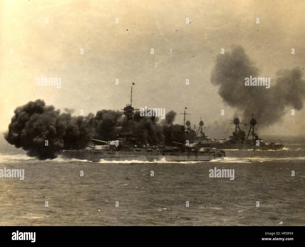 Several U.S. battleships conduct coordinated broadside firing exercises ...
