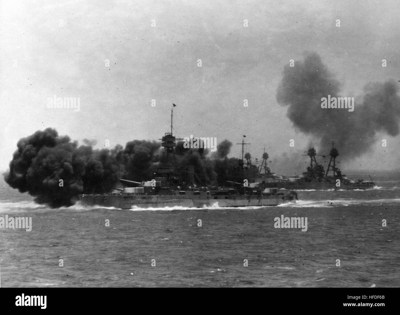 US battleships fire broadsides in the 1930s Stock Photo - Alamy