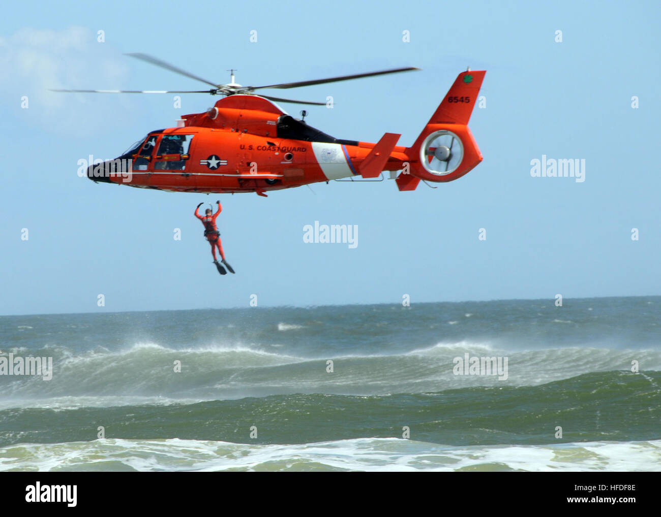 U.S. Coast Guardsmen demonstrate a search and rescue mission during the ...