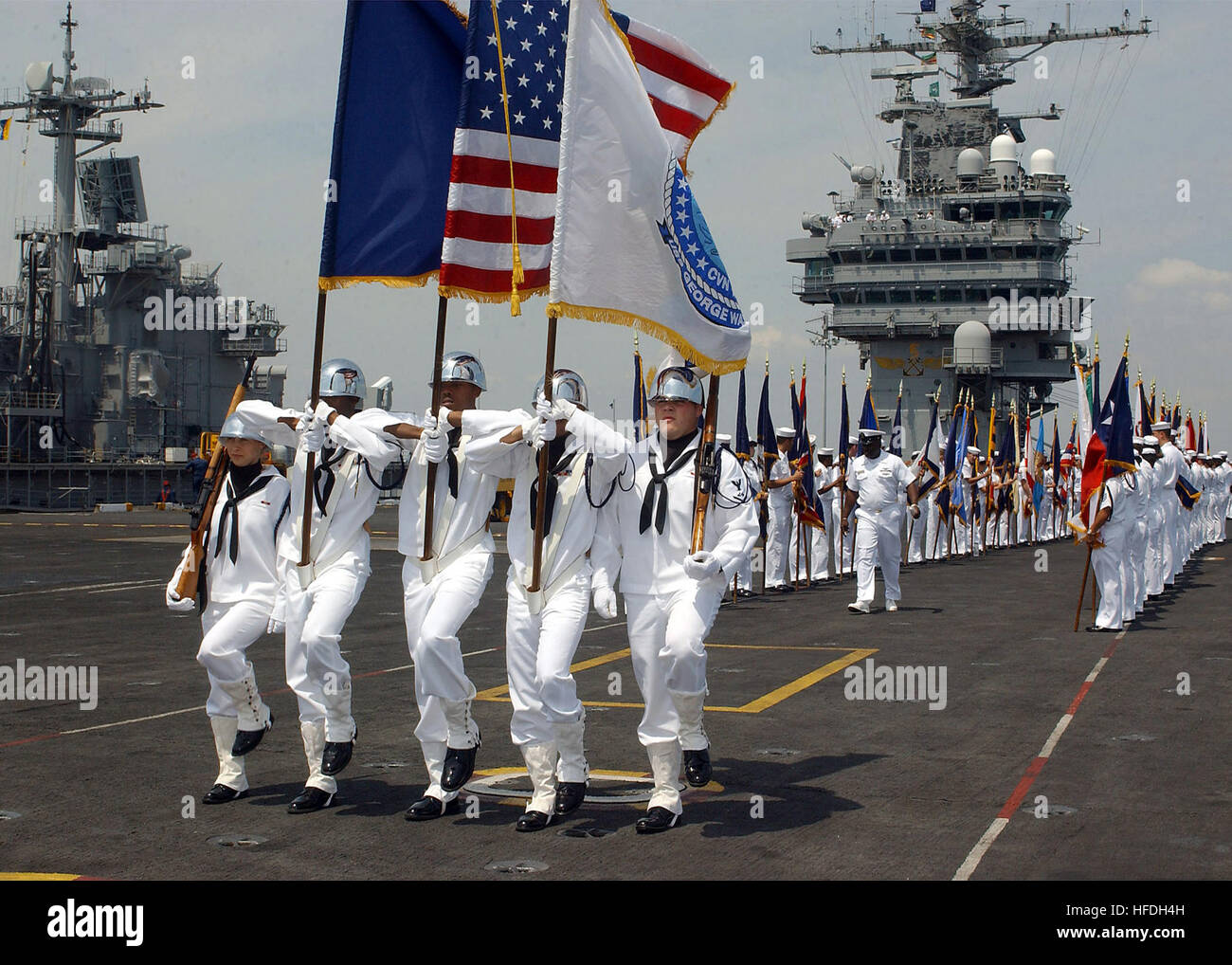 Sailors aboard USS George Washington (CVN 73) prepare to display the 50 ...
