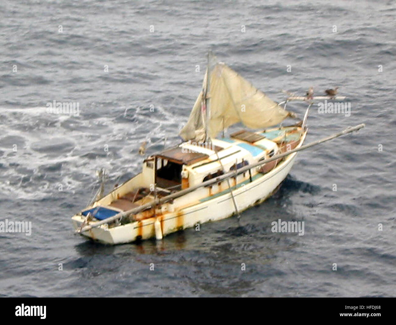 The U.S. Navy frigate USS McClusky rescues a civilian adrift on a ...
