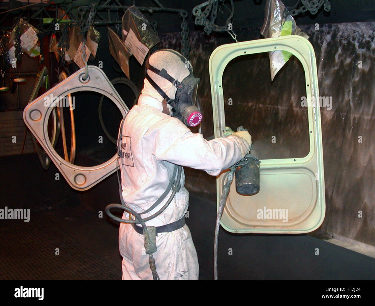 A painter at Naval Air Systems Command (NAVAIRSYSCOM) aircraft ...