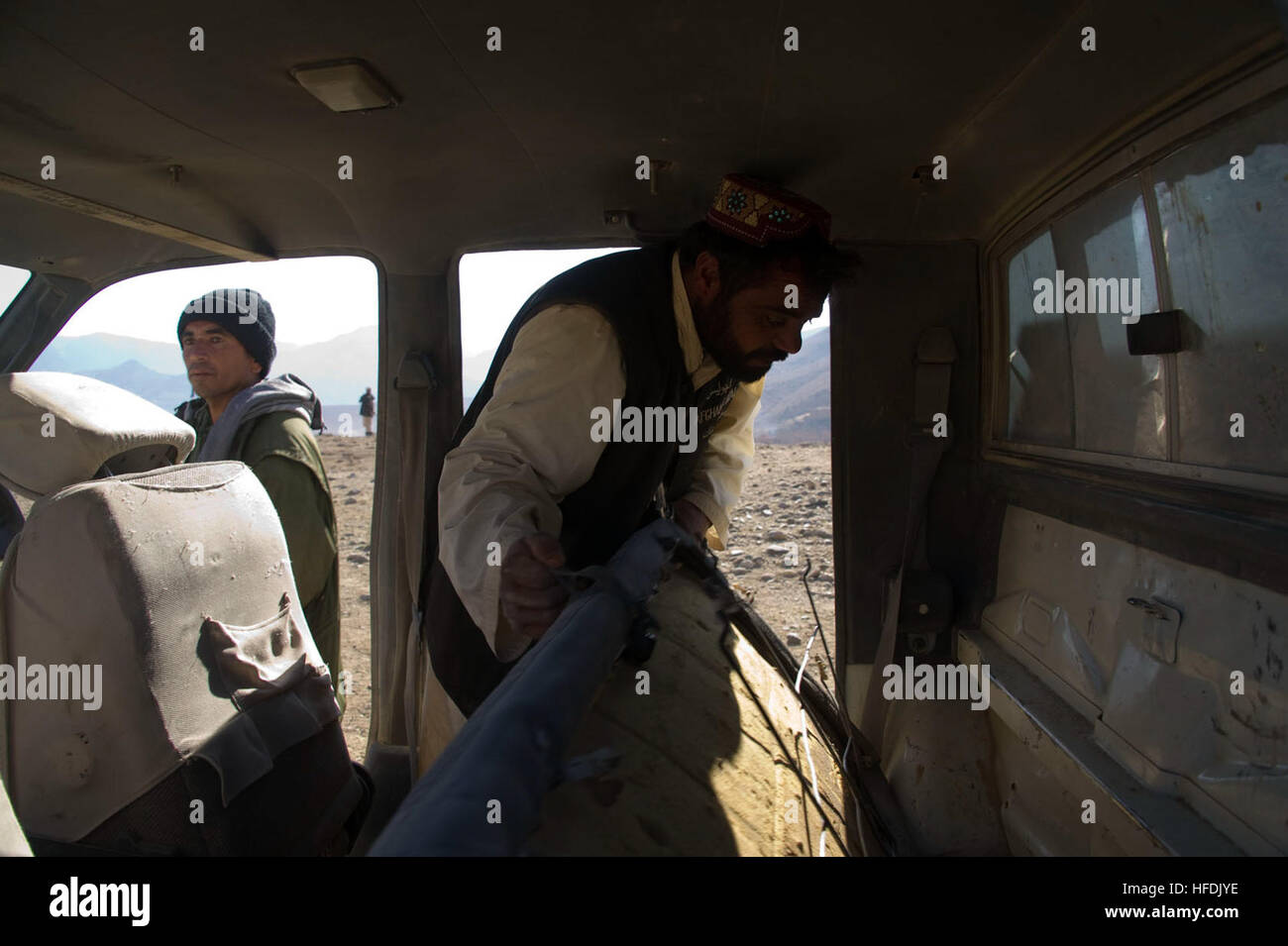 Afghan Local Police candidates search a vehicle during a checkpoint ...