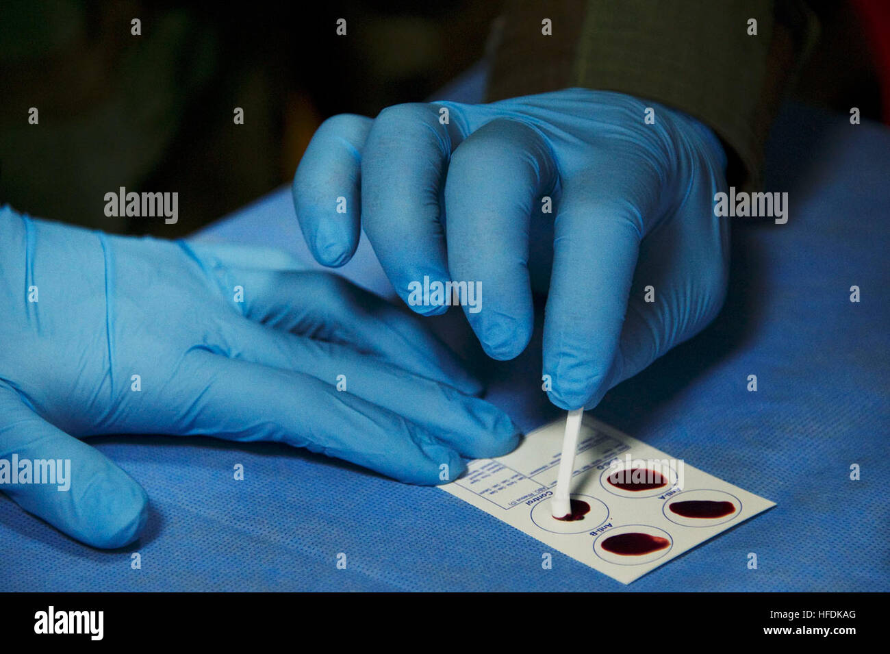 A soldier from the 8th Commando Kandak smears blood samples on a blood ...